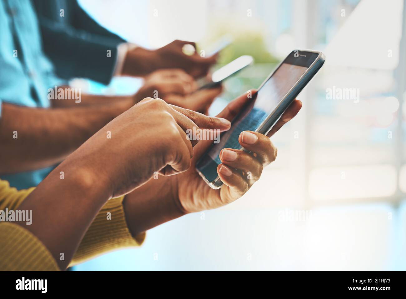 The wireless workforce. Cropped shot of unrecognizable businesspeople ...