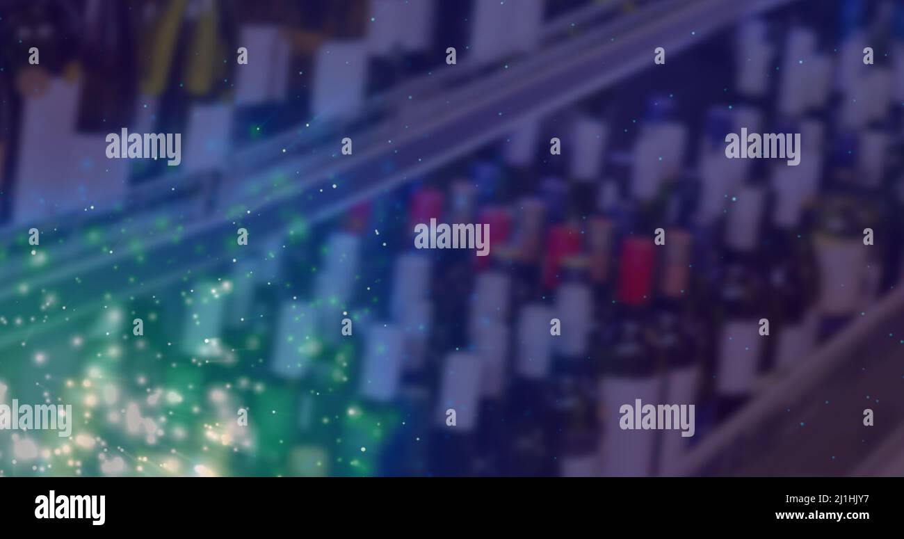 Image of lights over blurred alcohol shop in blue Stock Photo - Alamy