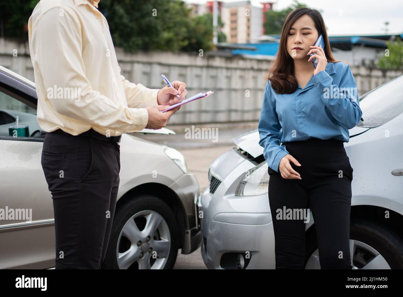 Asian women driver Talk to Insurance Agent for examining damaged car ...
