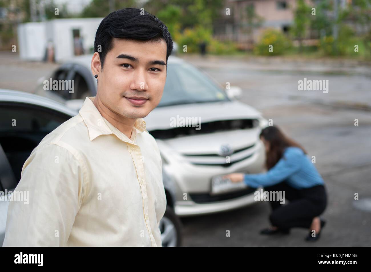 Happy businessman drivers do not worry after a car accident because ...