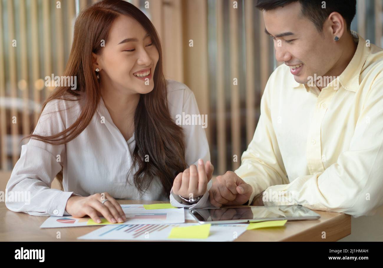 Happy Asian couples be smile after calculating income And expenses ...