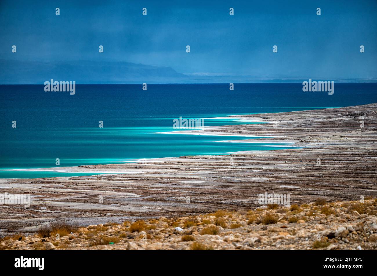 Salt beach of the Dead Sea in Jordan Stock Photo - Alamy