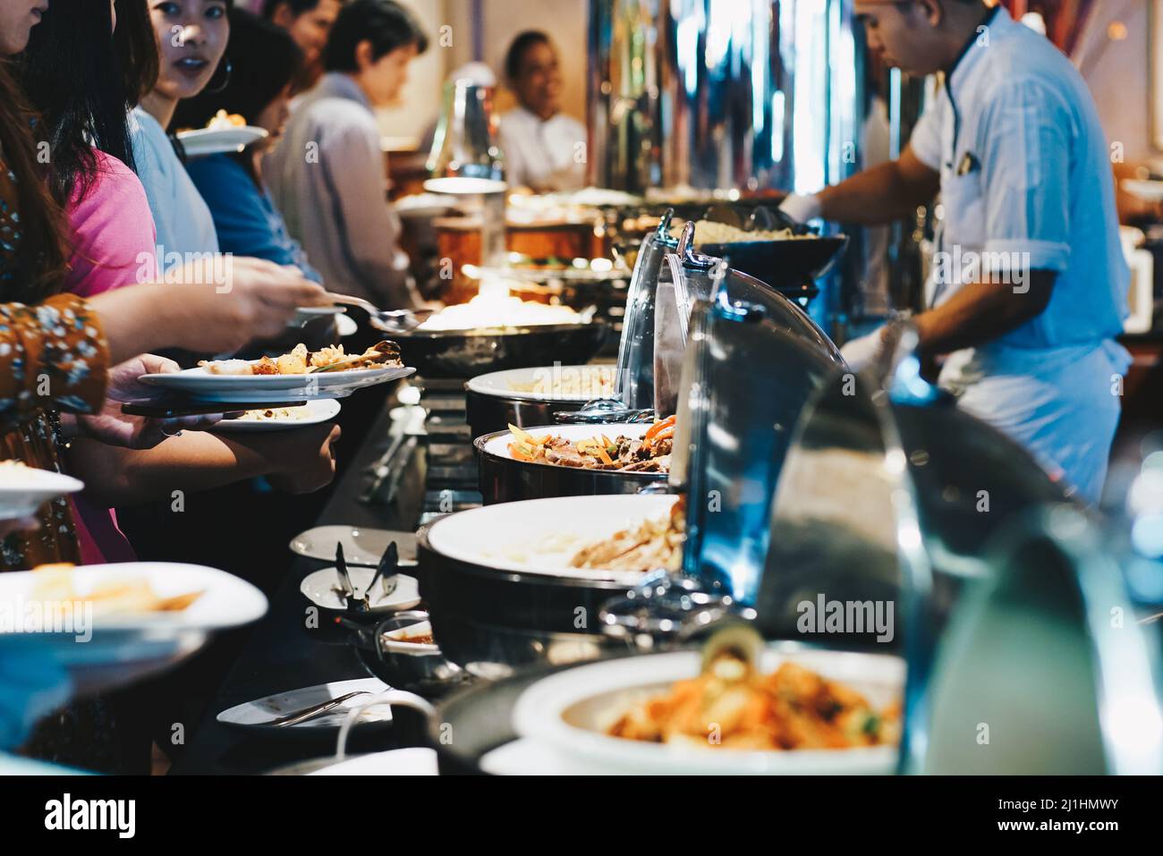 Crowd of people enjoying buffet food meal dining Food Options Eating ...