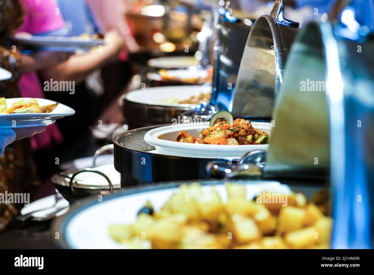 Crowd of people enjoying buffet food meal dining Food Options Eating ...