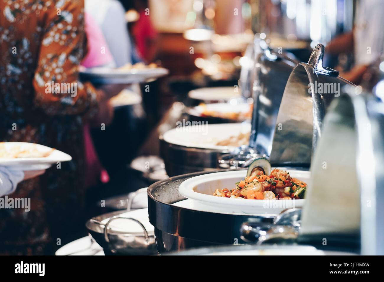 Crowd of people enjoying buffet food meal dining Food Options Eating ...