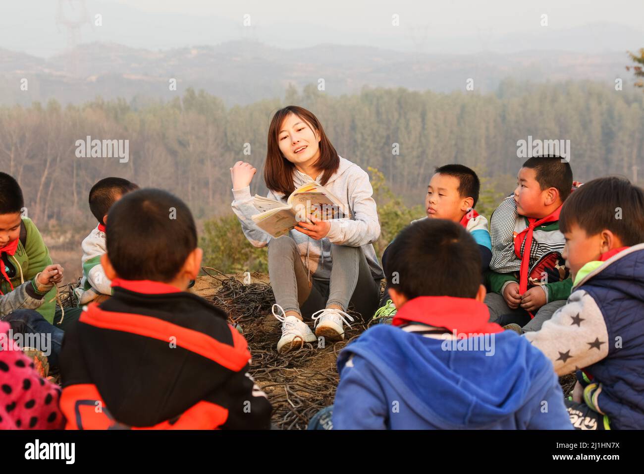 Rural teachers and pupils learning in the open air Stock Photo - Alamy