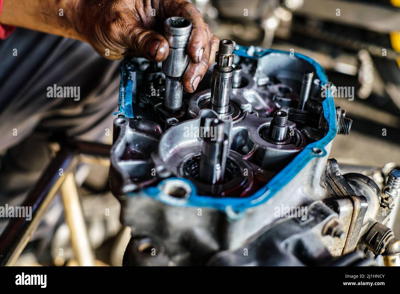 Repairing motorcycle machine part of motorcycle engine overhaul, fixing ...
