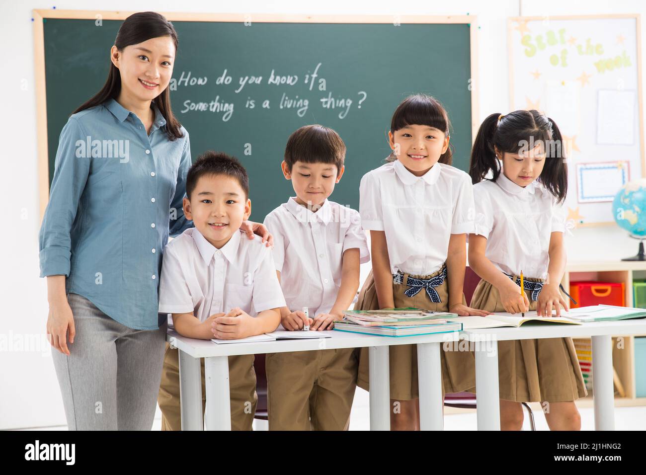 Teachers and pupils in the classroom Stock Photo - Alamy