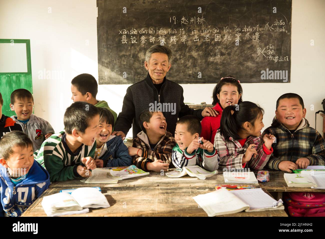 Rural male teachers and students in the classroom Stock Photo - Alamy