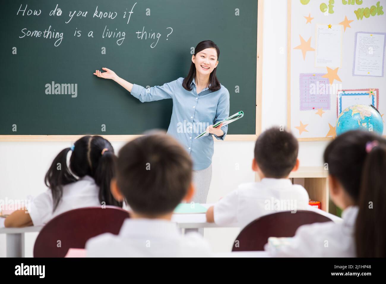 Teachers and pupils in the classroom Stock Photo - Alamy