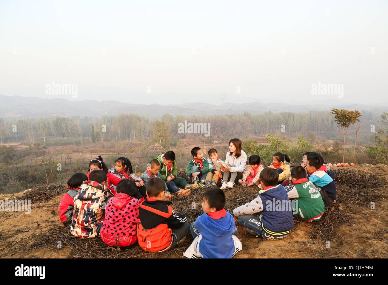 Rural teachers and pupils learning in the open air Stock Photo - Alamy