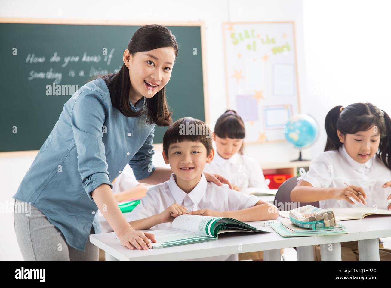 Teachers and pupils in the classroom Stock Photo - Alamy