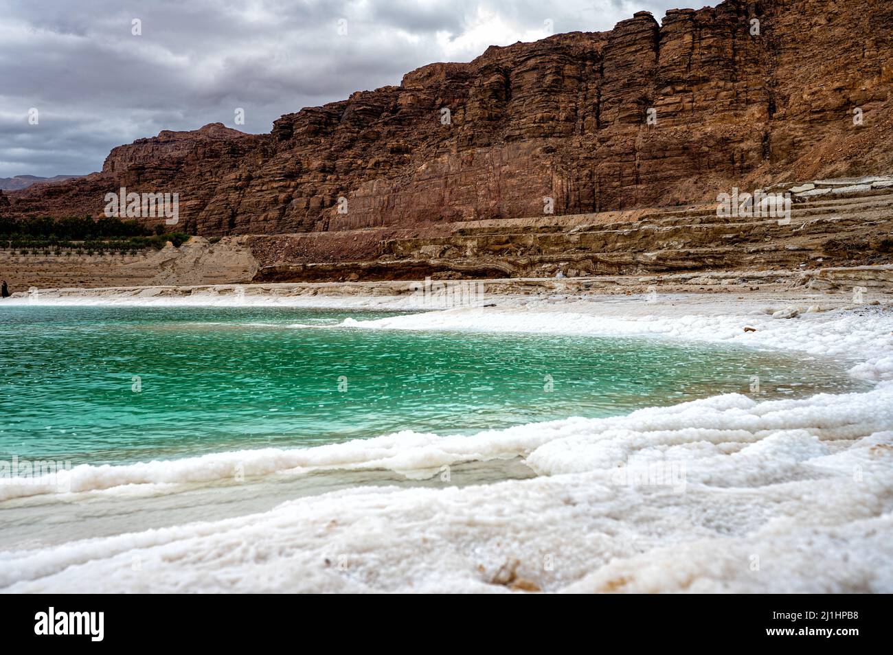 Salt beach of the Dead Sea at sunset, Jordan Stock Photo - Alamy