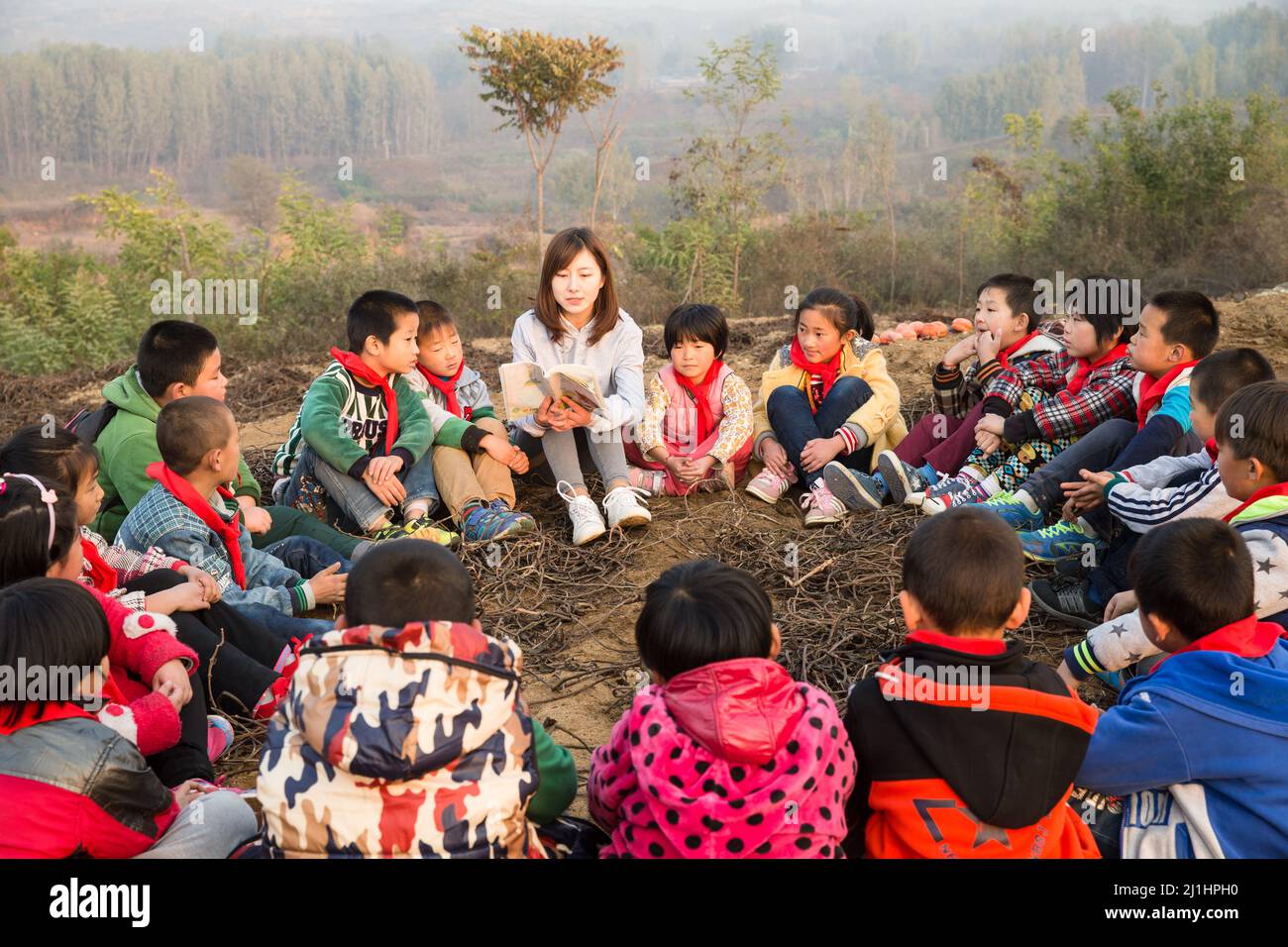 Rural teachers and pupils learning in the open air Stock Photo - Alamy