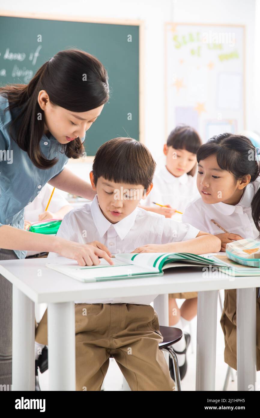 Teachers and pupils in the classroom Stock Photo - Alamy