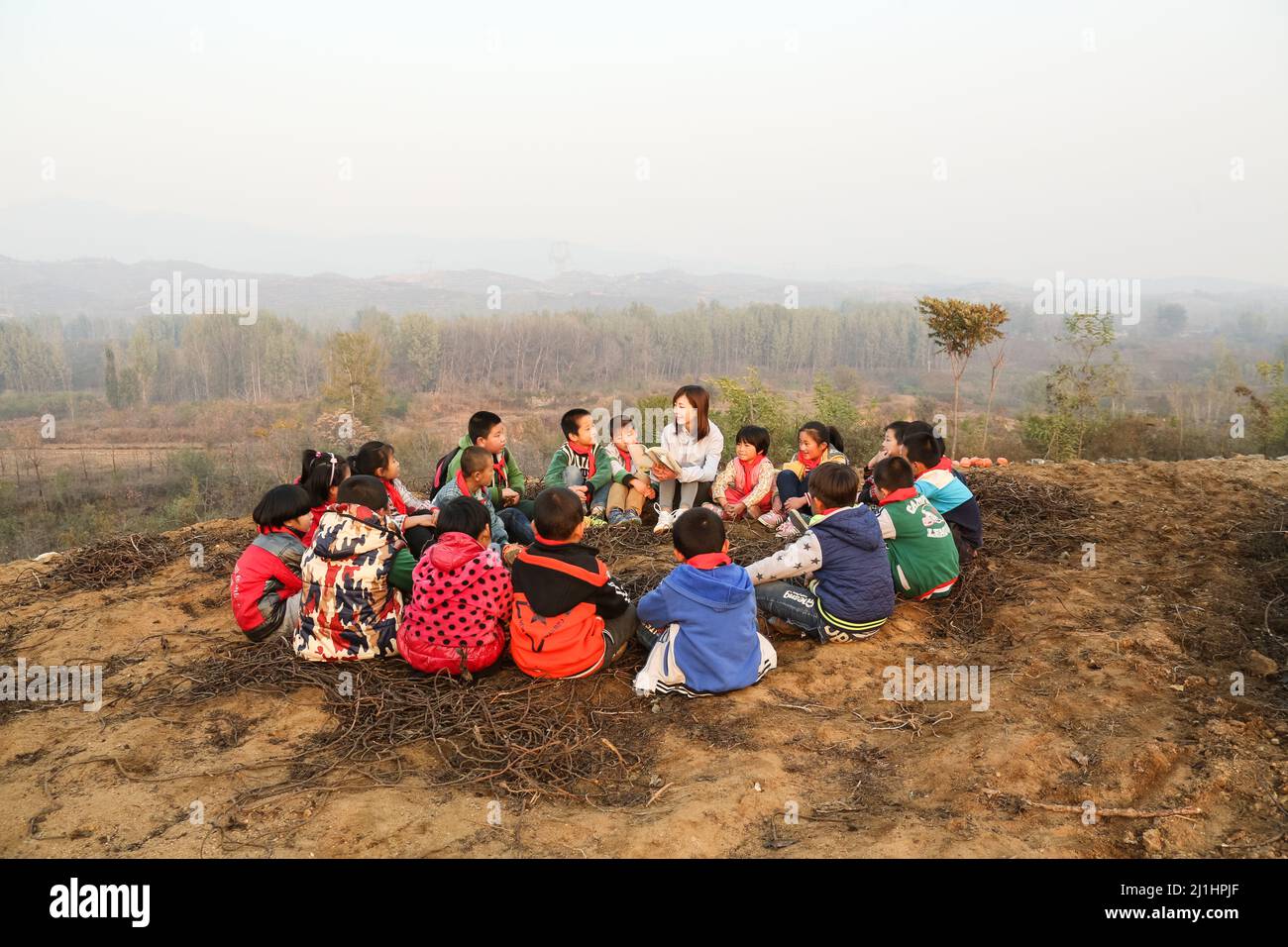 Rural teachers and pupils learning in the open air Stock Photo - Alamy