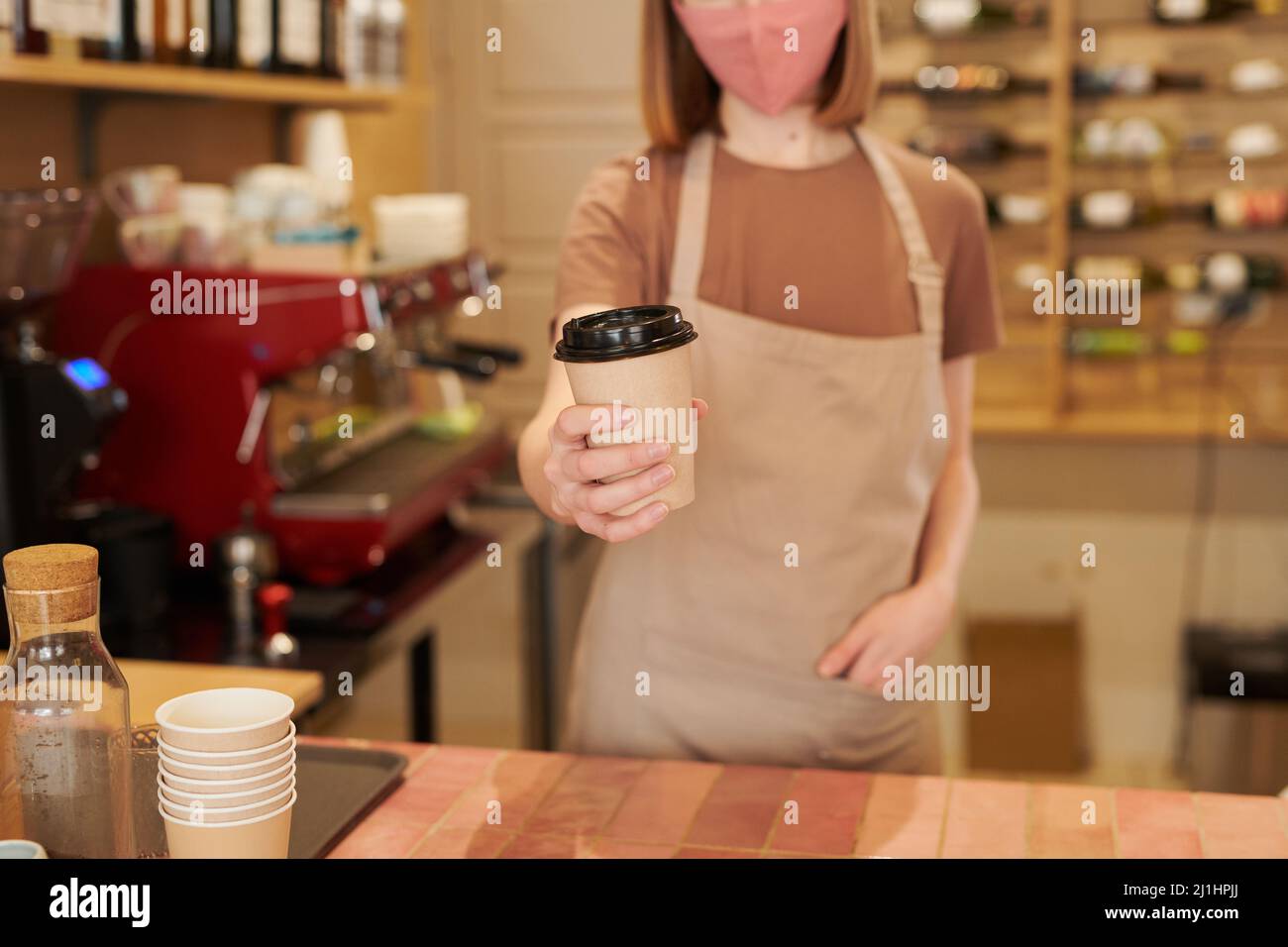Medium section shot of unrecognizable female barista standing at ...