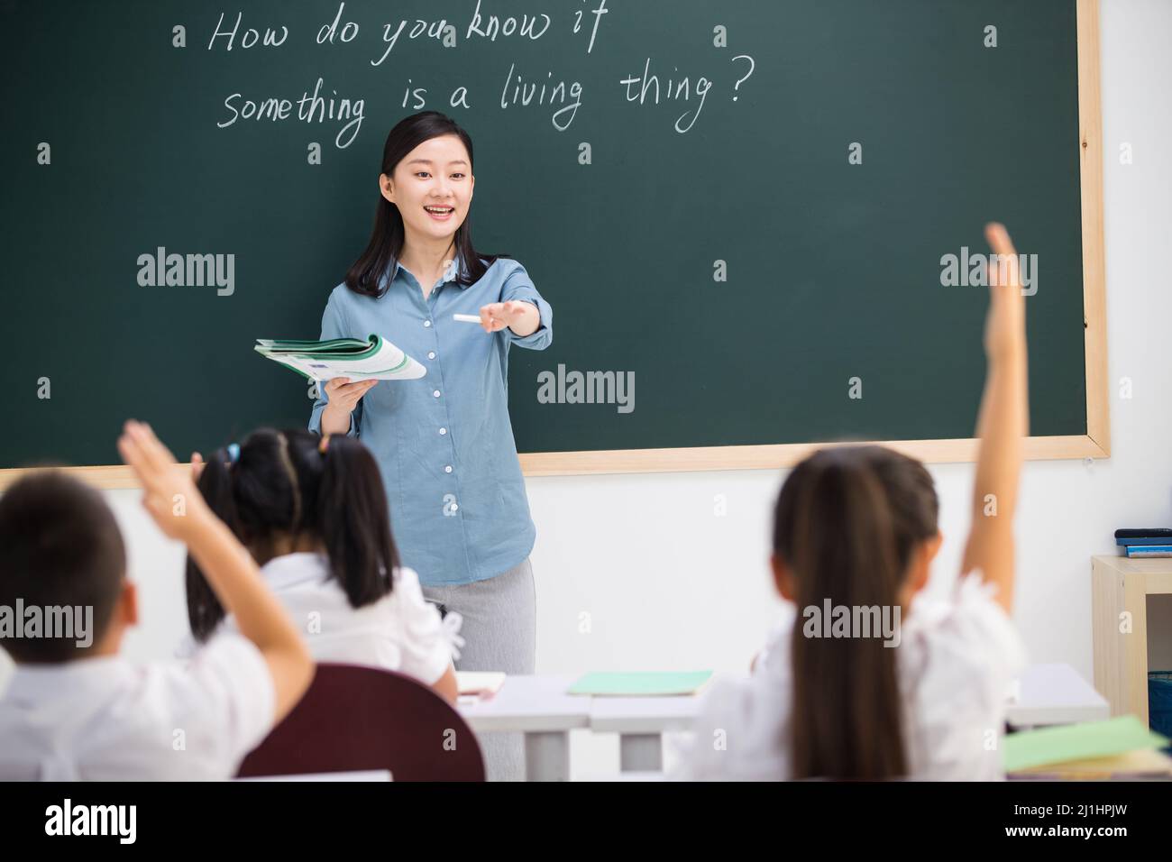 Teachers and pupils in the classroom Stock Photo - Alamy
