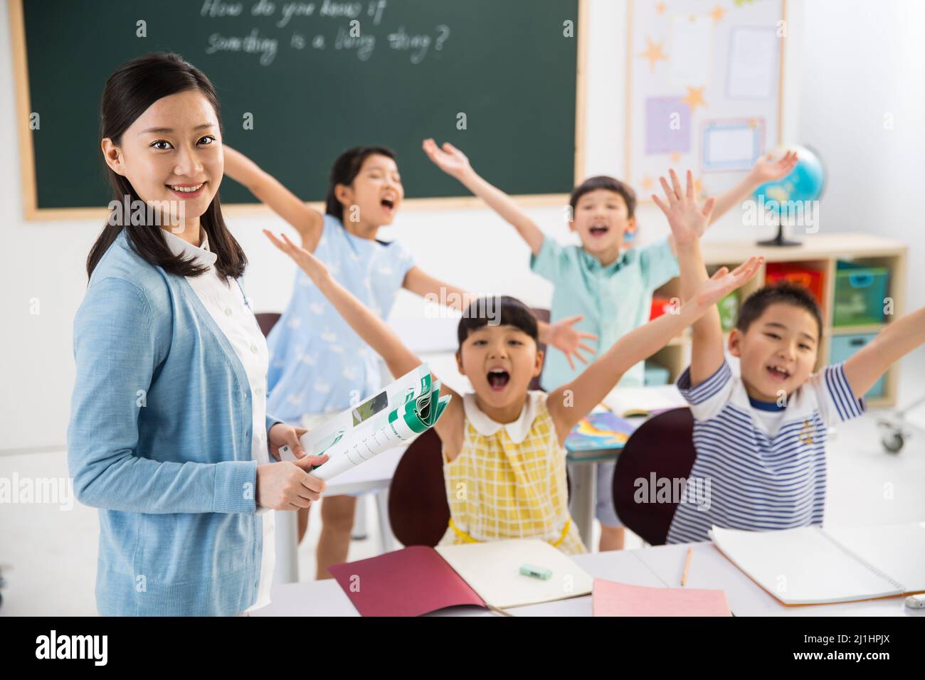 Teachers and pupils in the classroom Stock Photo - Alamy