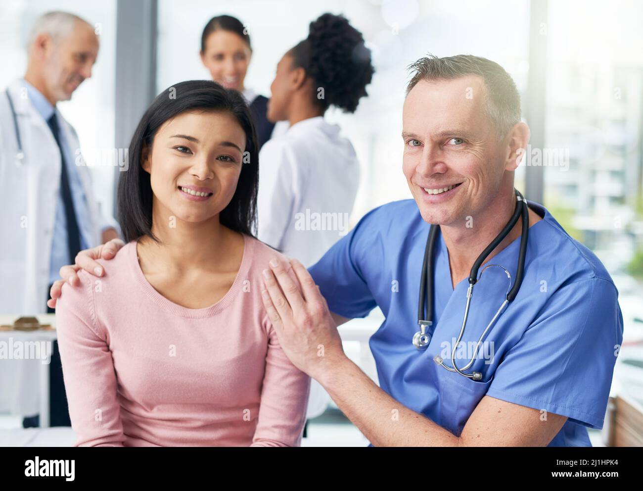 Her recovery was a team effort. Portrait of a happy doctor and his ...