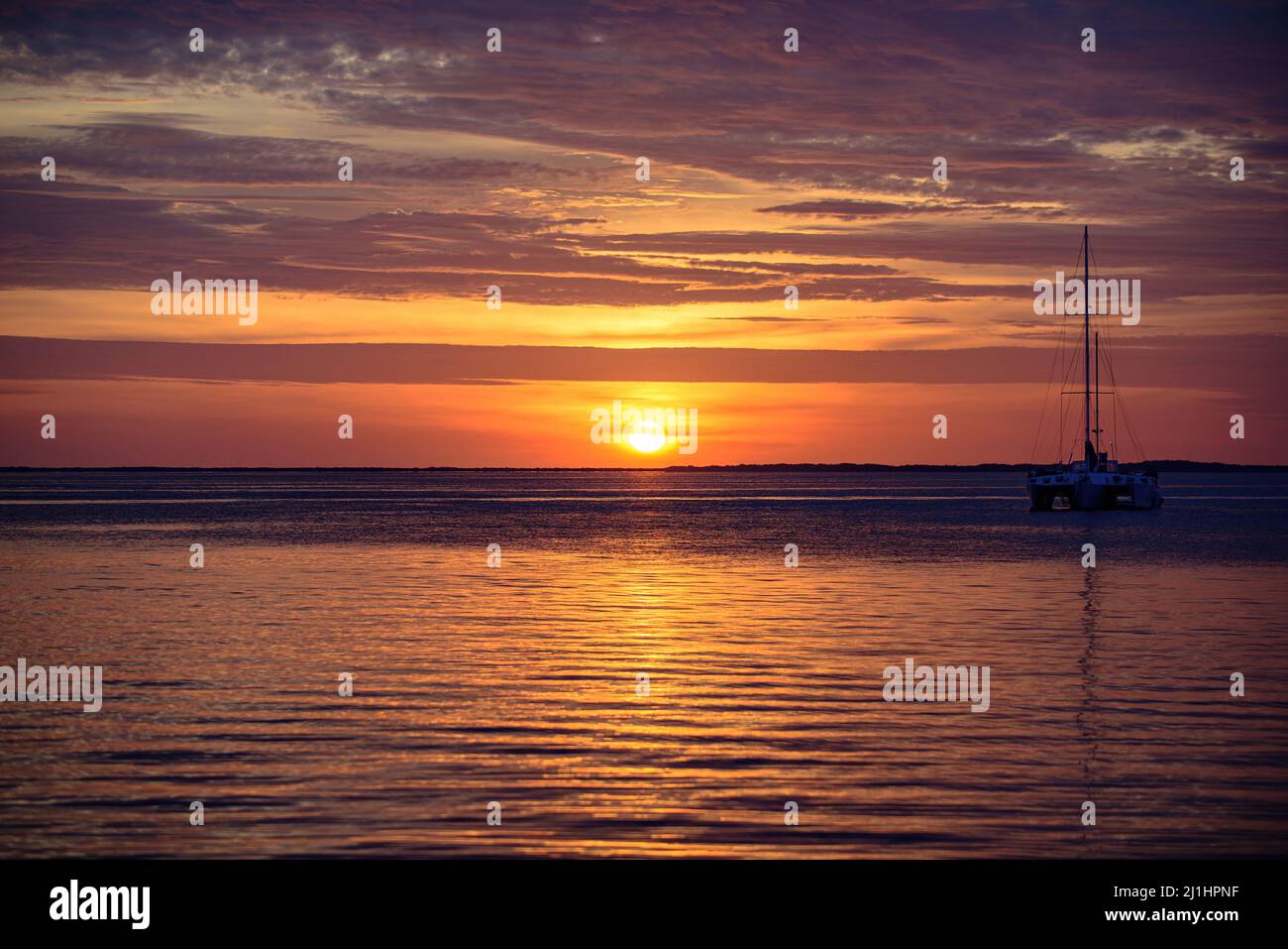 Sunset over sea with golden dramatic sky panorama. Calm sea with sunset ...
