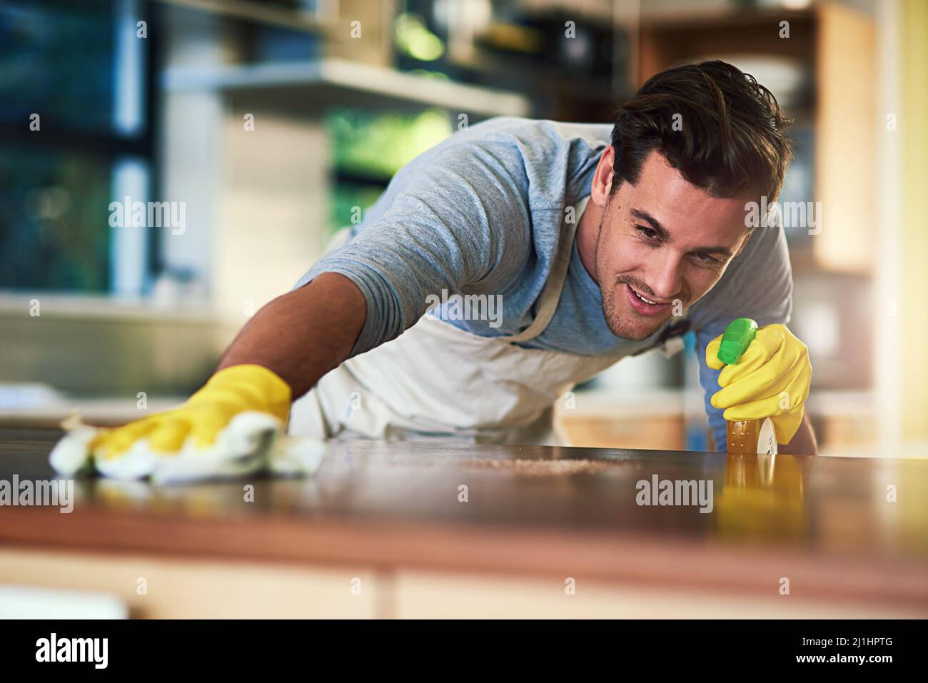 The kitchen will soon be sparkling clean and spotless. Cropped shot of ...