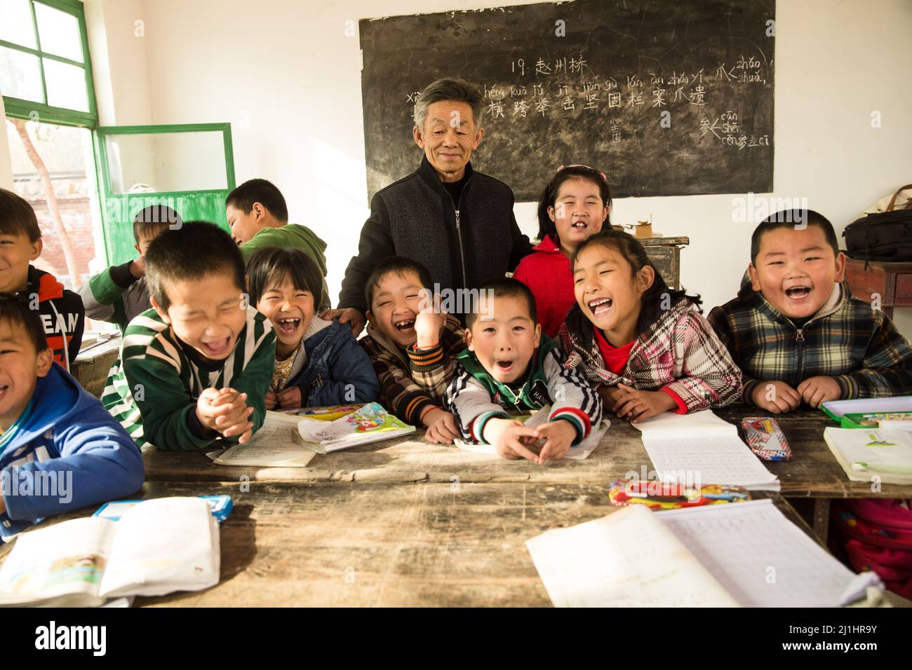 Rural male teachers and students in the classroom Stock Photo - Alamy