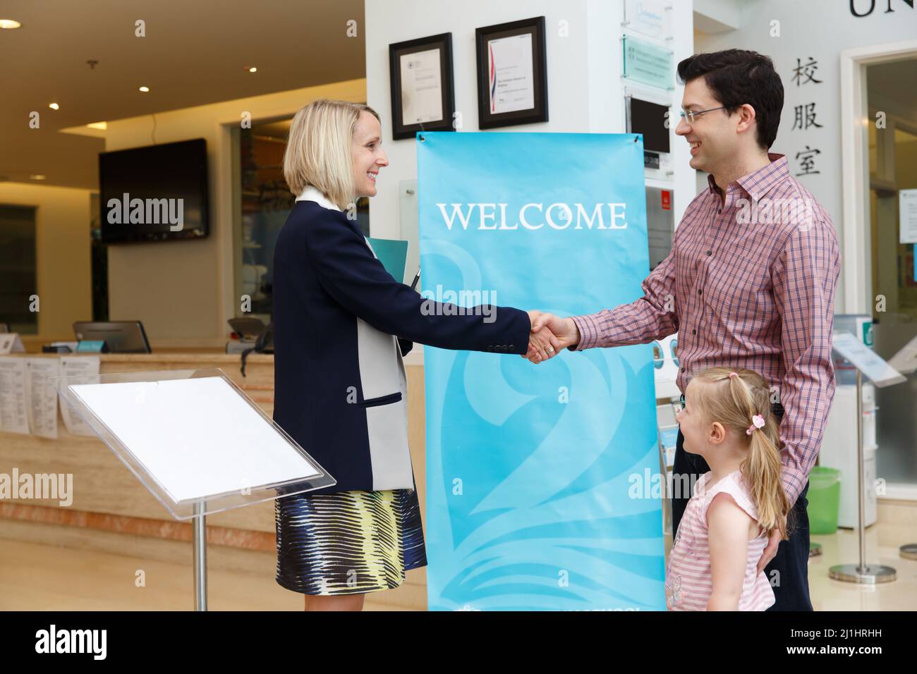 Handshake teacher student hi-res stock photography and images - Alamy