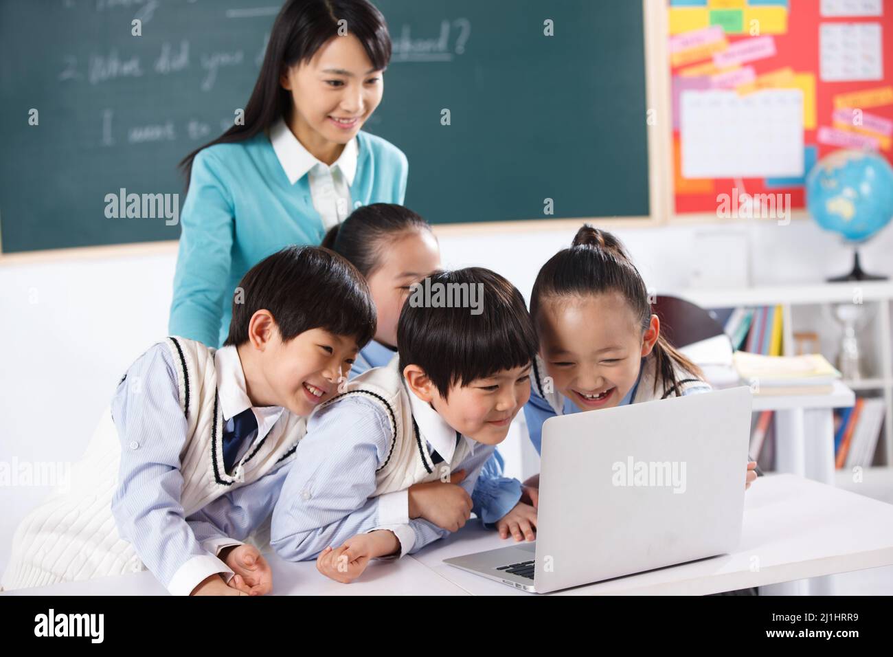 Elementary school students and teachers in class Stock Photo - Alamy