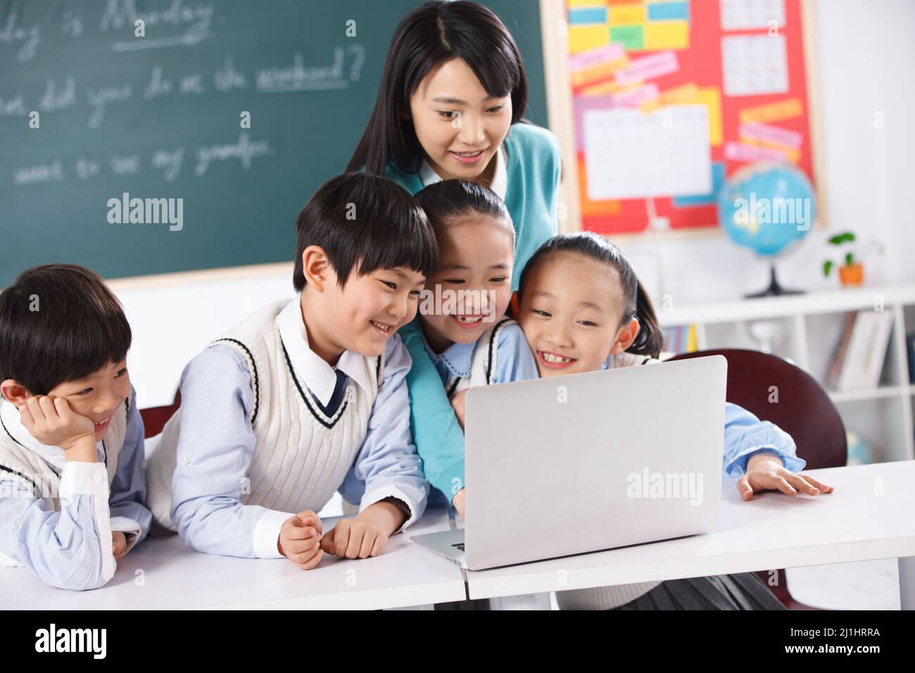 Elementary school students and teachers in class Stock Photo - Alamy