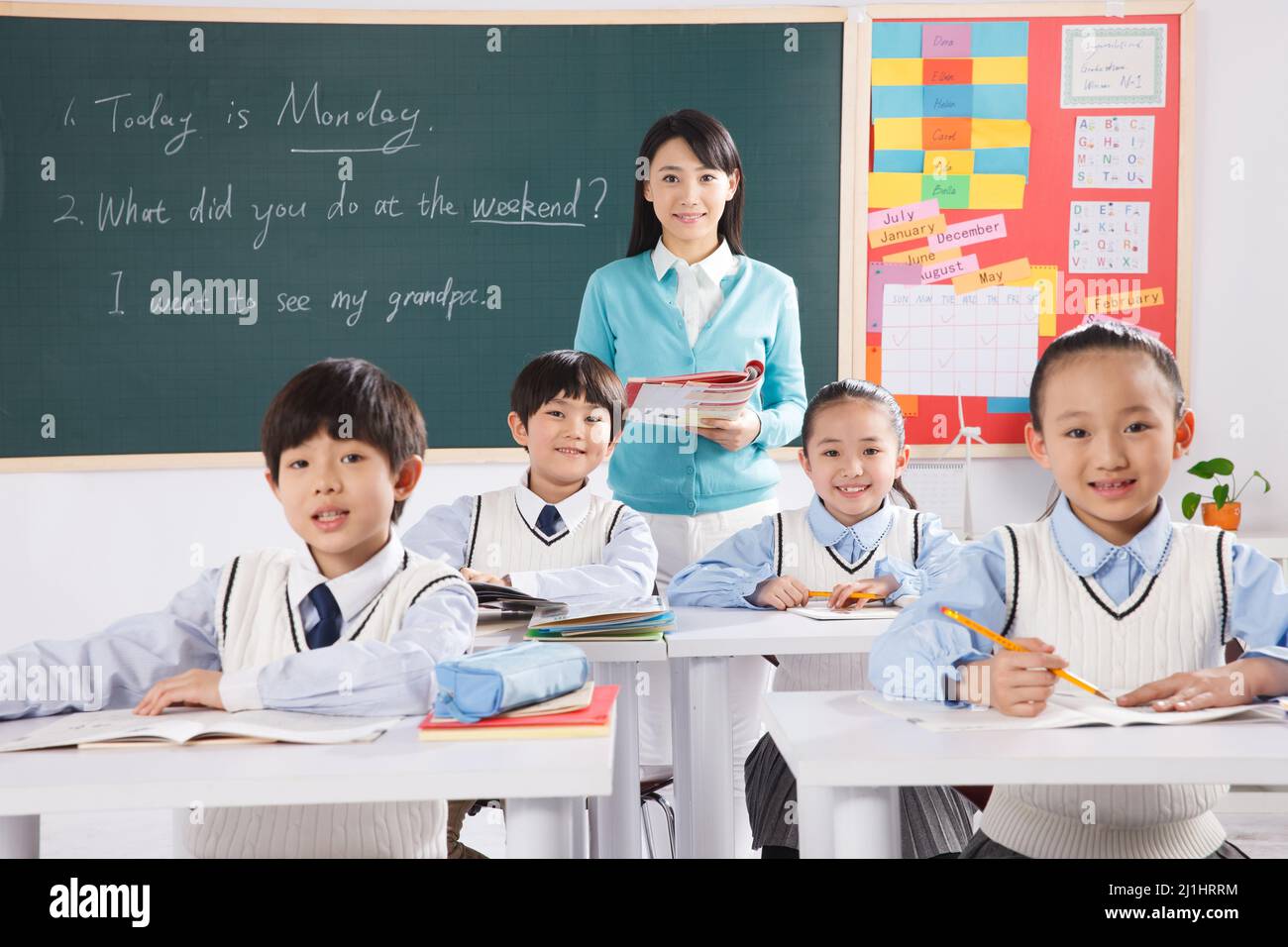 Elementary school students and teachers in class Stock Photo - Alamy