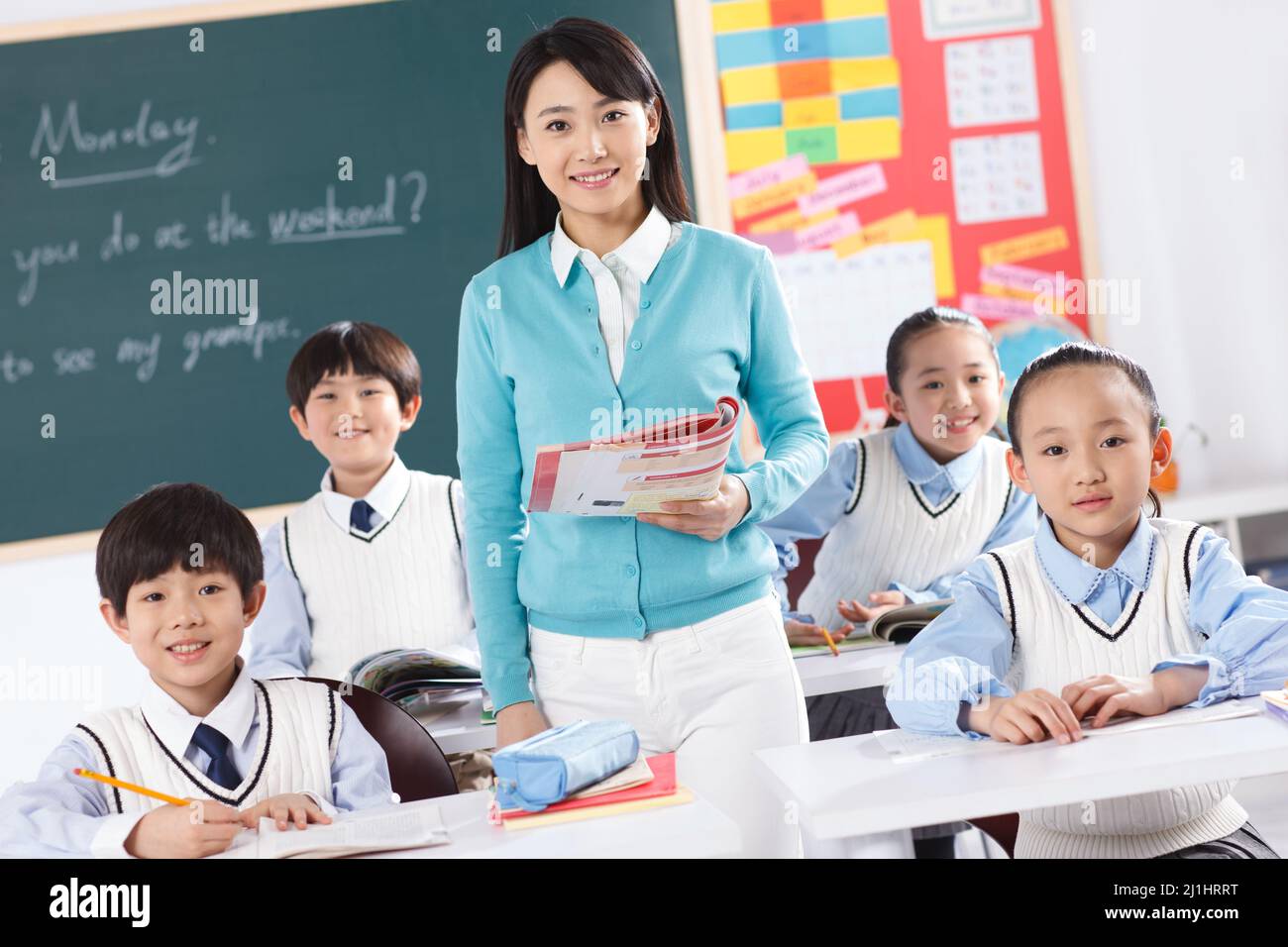 Elementary school students and teachers in class Stock Photo - Alamy