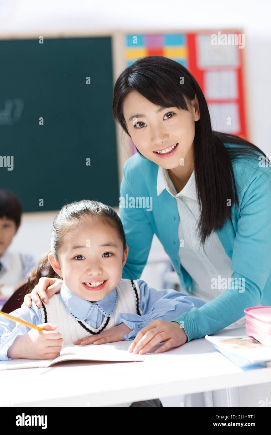 Elementary school students and teachers in class Stock Photo - Alamy