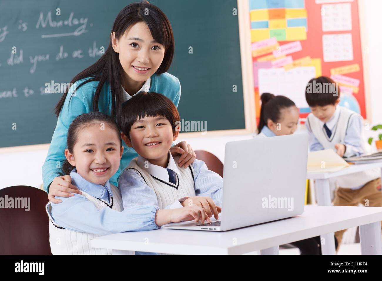 Elementary school students and teachers in class Stock Photo - Alamy