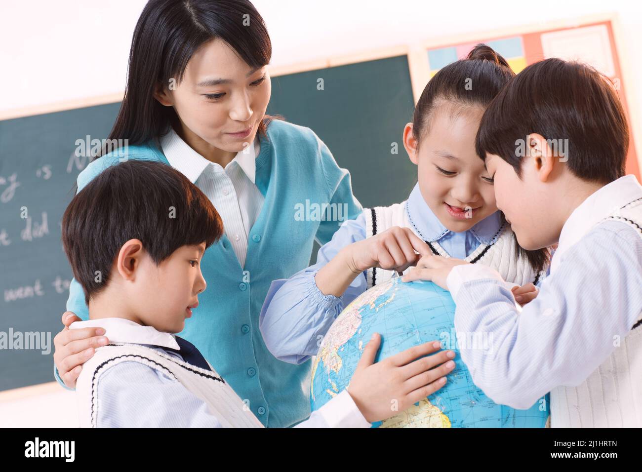 Elementary school students and teachers in class Stock Photo - Alamy