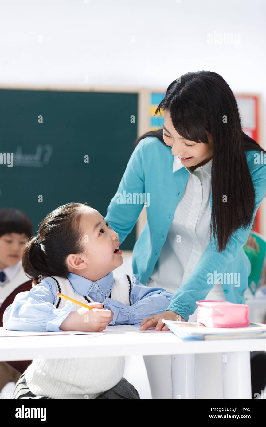 Elementary school students and teachers in class Stock Photo - Alamy