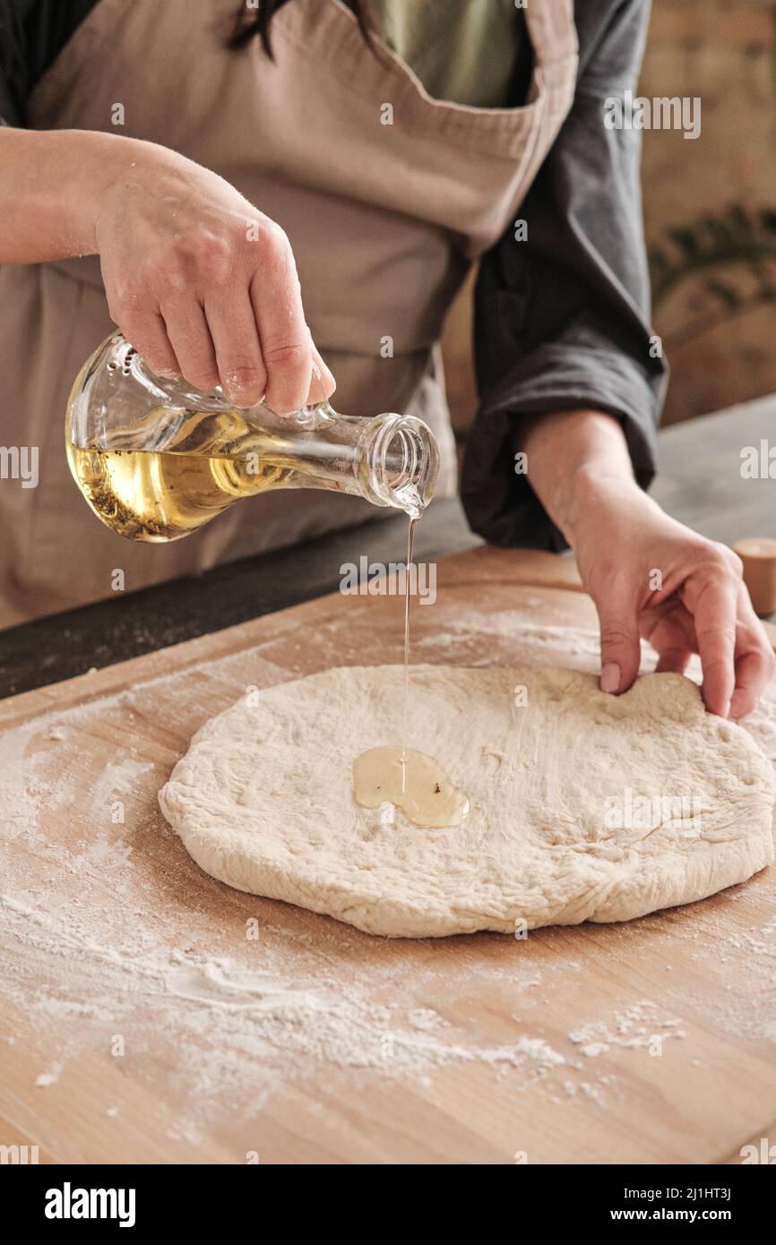 Female hand pouring oil hi-res stock photography and images - Alamy