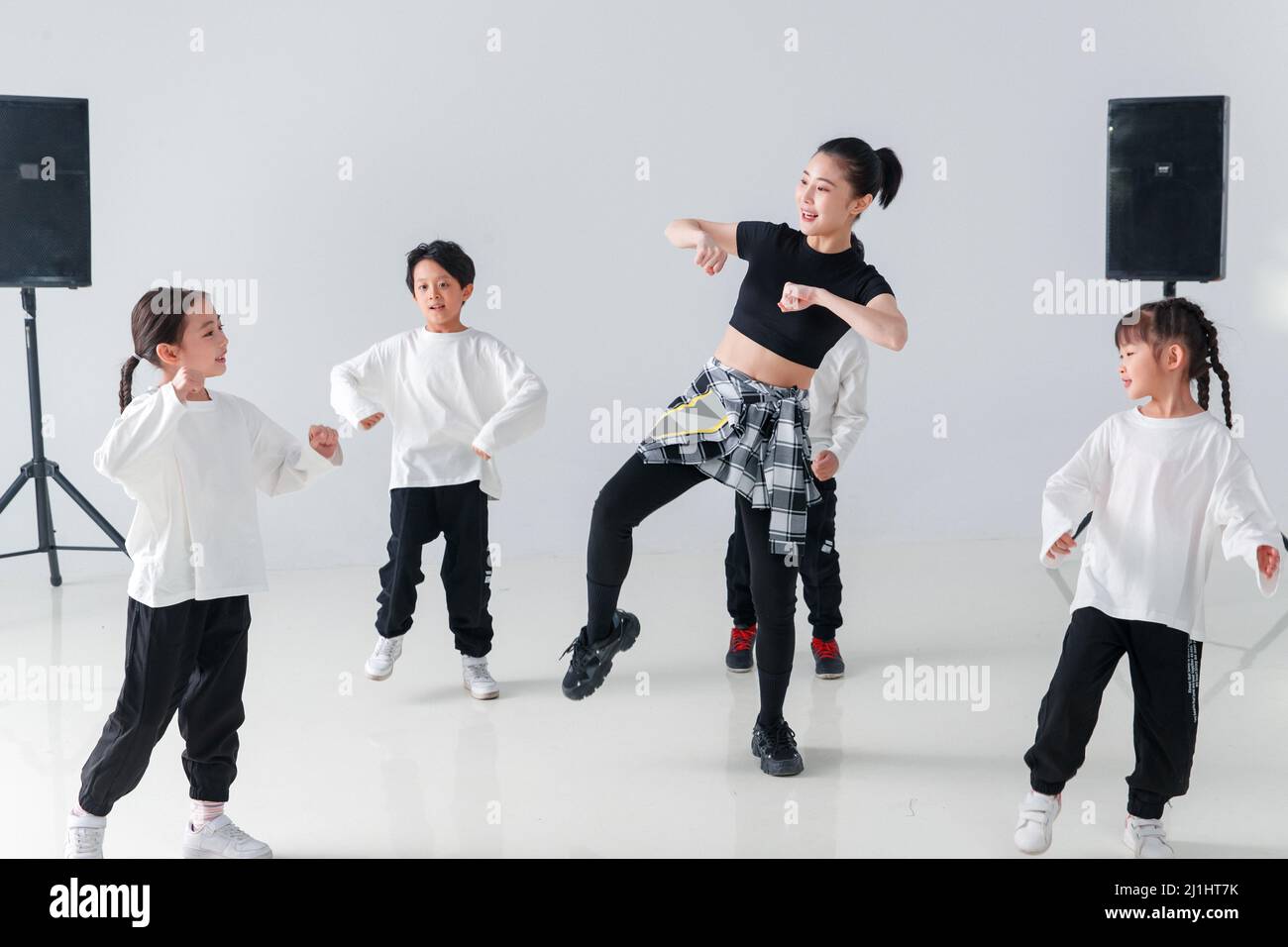 Dance teacher to teach the children learn how to dance Stock Photo - Alamy