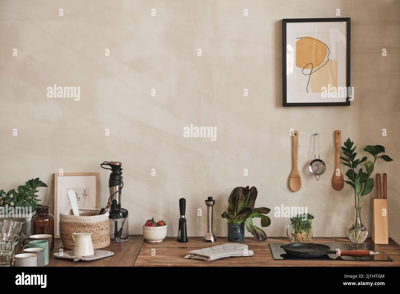Cozy interior of kitchen with abstract picture and utensils in wall ...