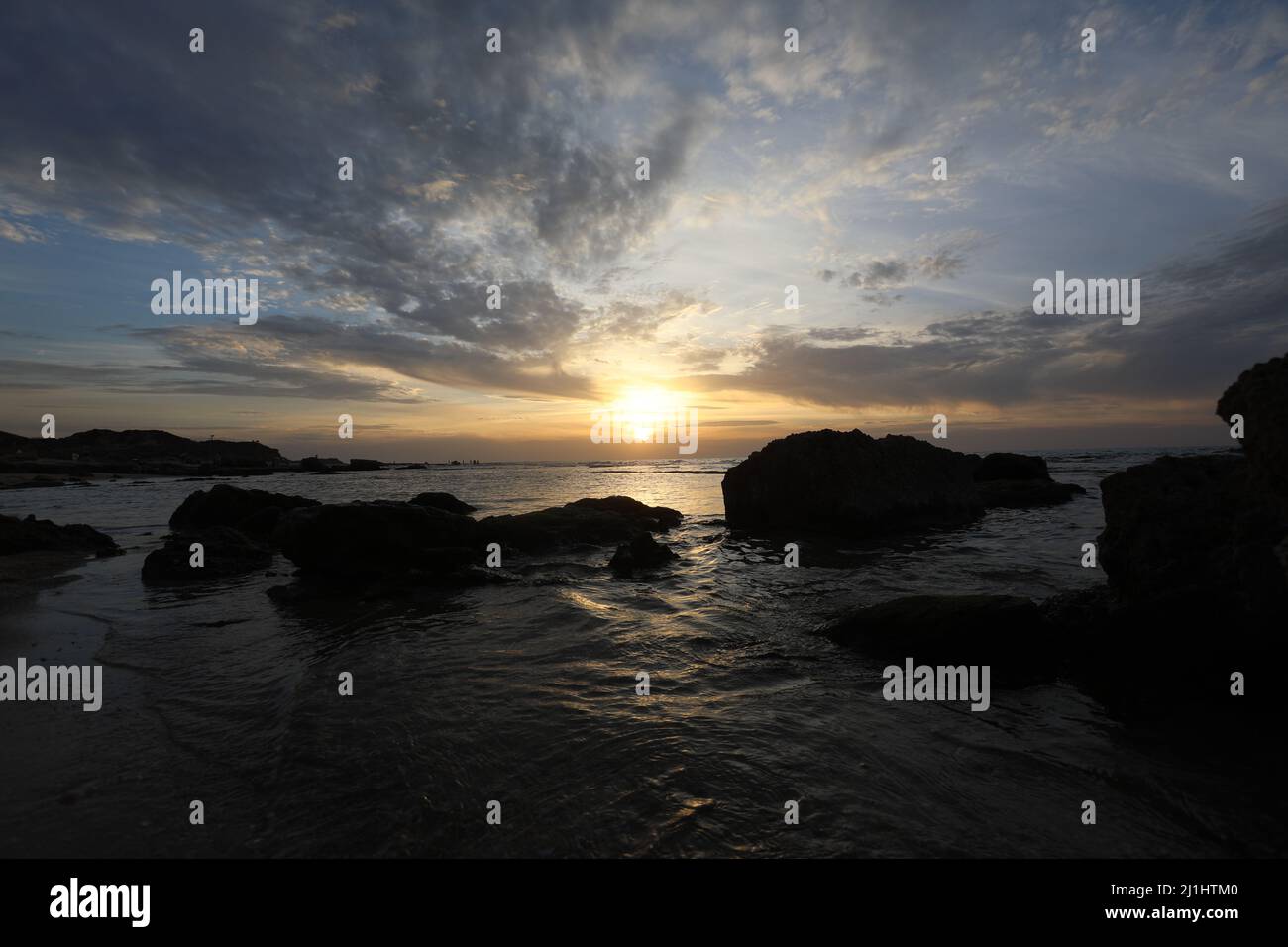 Man alone in the sea lonely feeling sunset time Stock Photo - Alamy