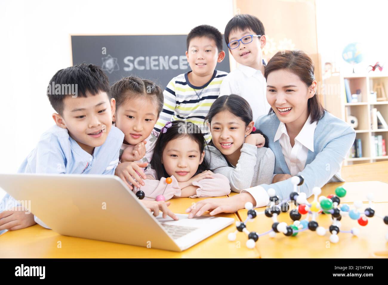 Female teachers and students use computers in the classroom Stock Photo ...