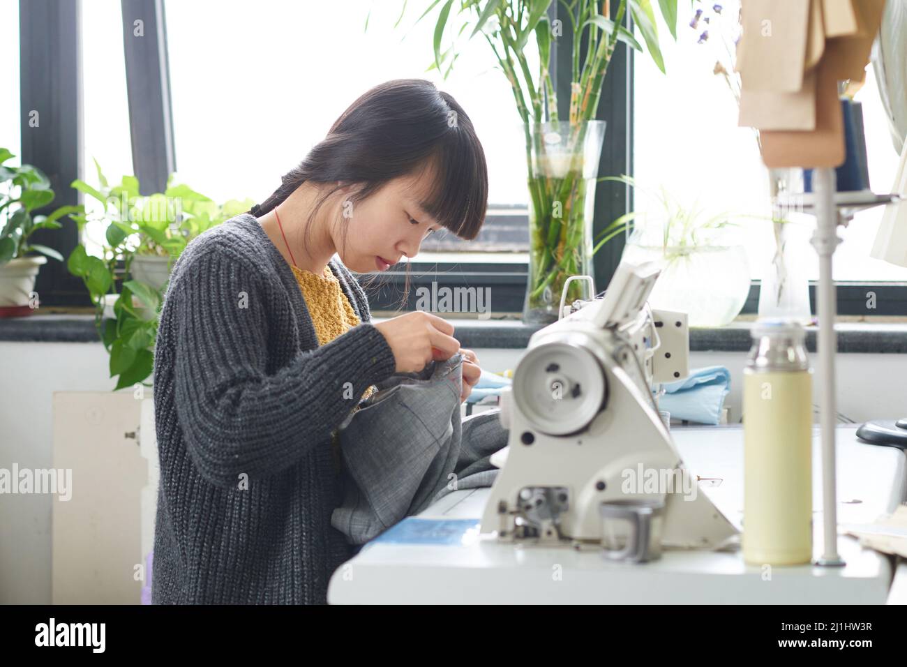 Trainee to study fashion design in the studio Stock Photo - Alamy
