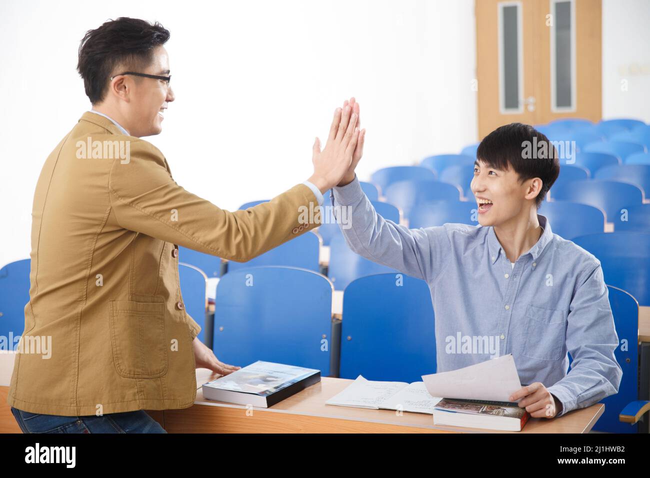 Asian teacher two students hi-res stock photography and images - Alamy