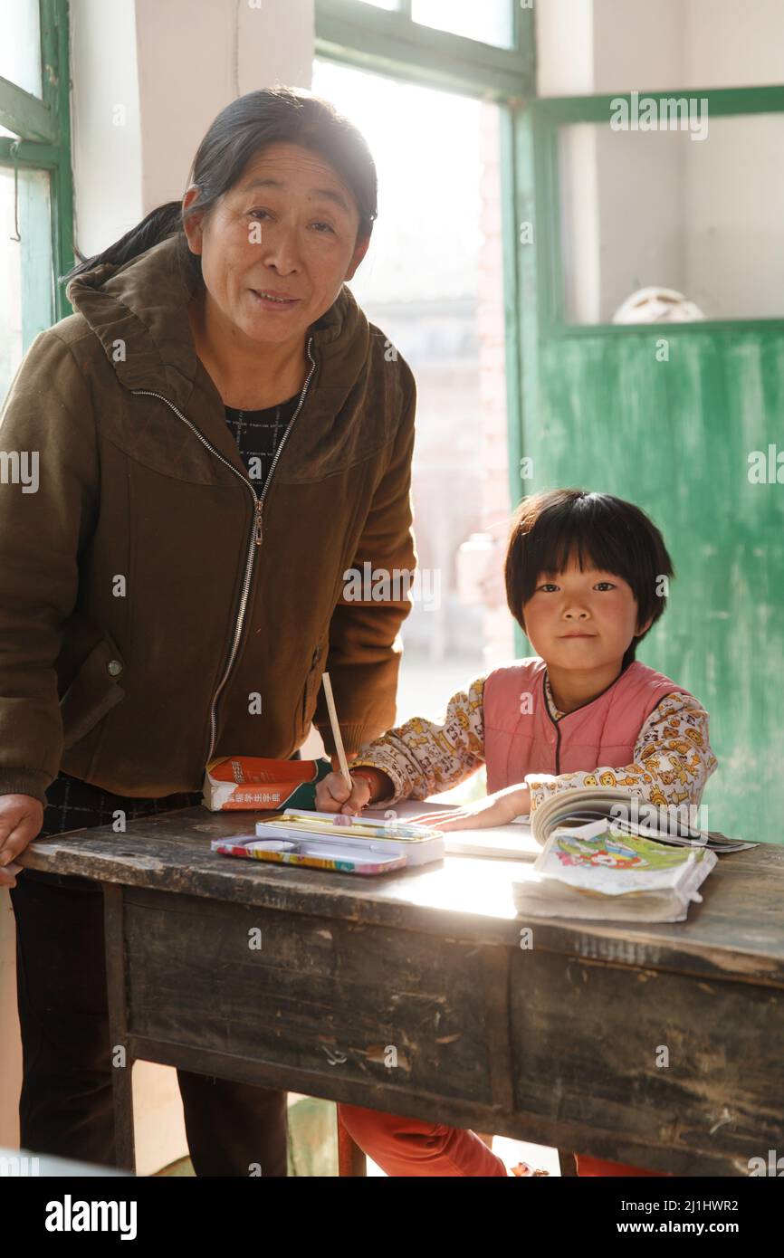 Rural female teachers and pupils in the classroom Stock Photo - Alamy