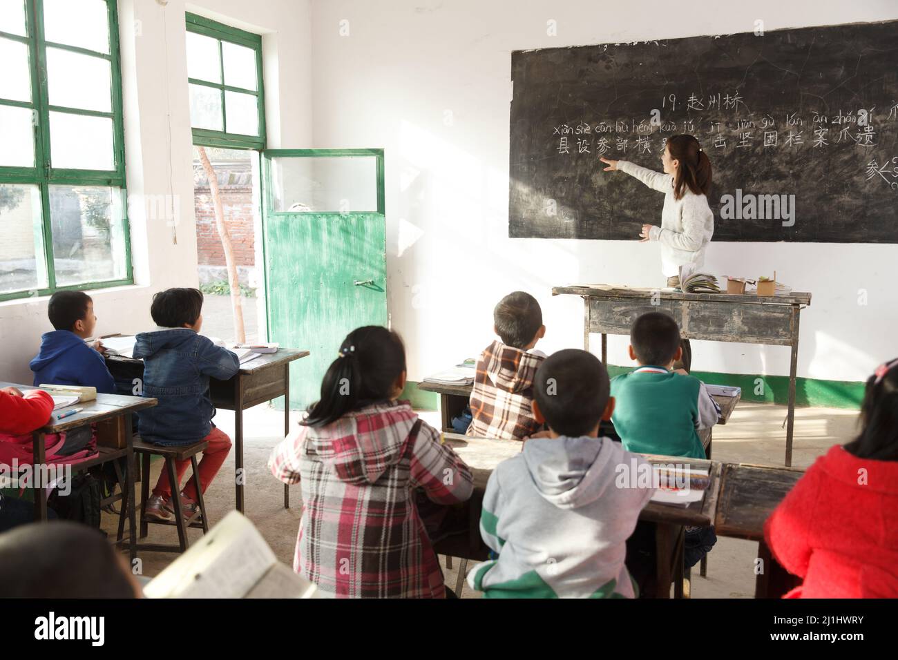Rural female teachers and pupils in the classroom Stock Photo - Alamy