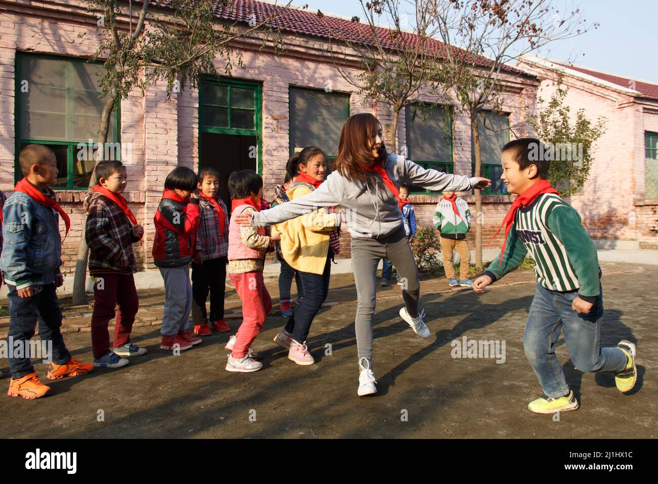 Rural teachers and pupils play games at school Stock Photo - Alamy