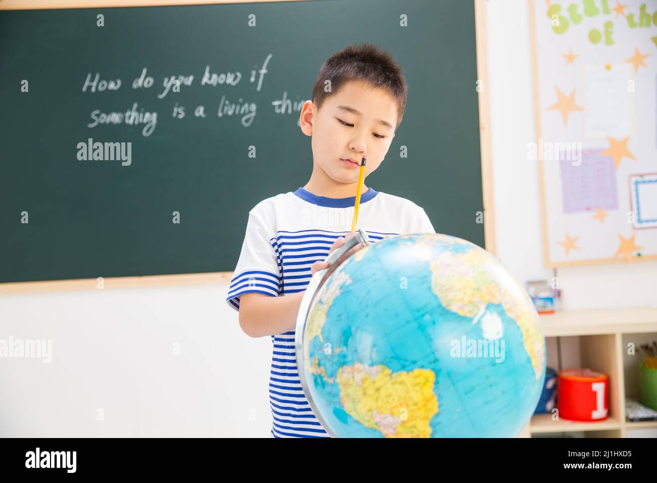 Primary school boy in the classroom Stock Photo - Alamy