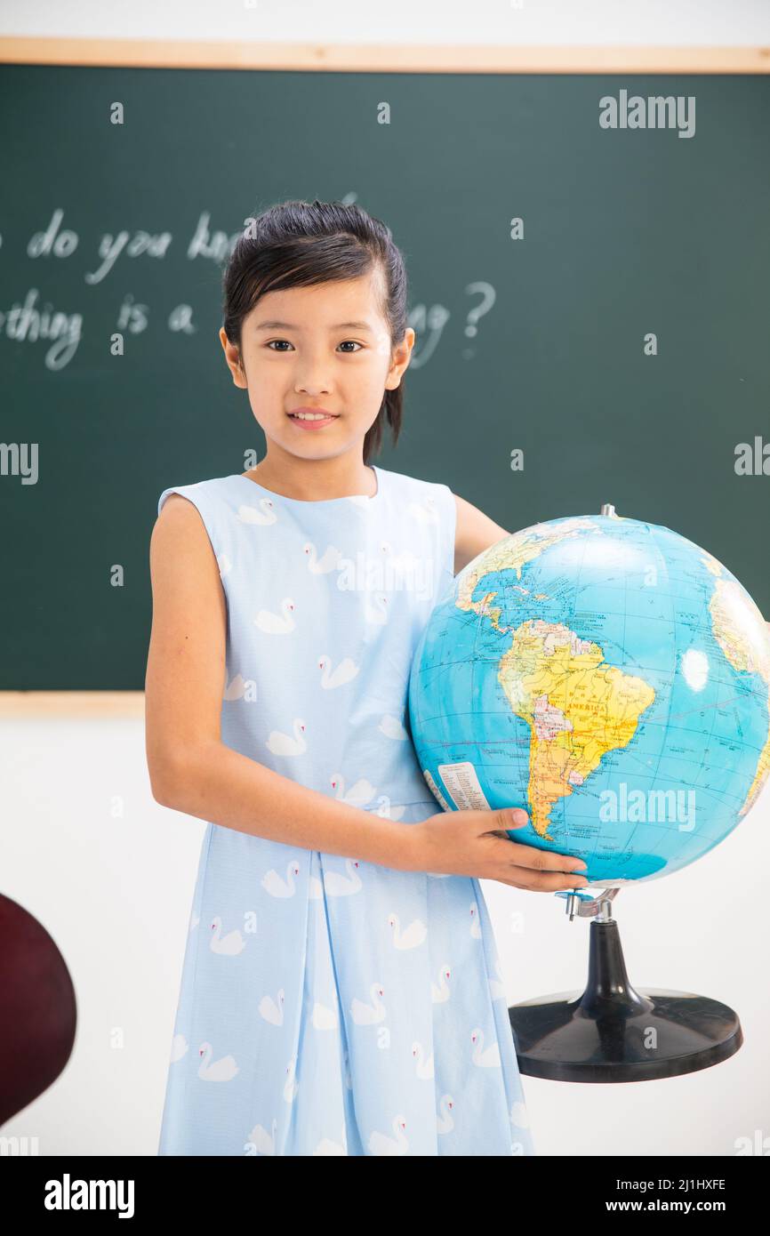 Primary school girls in the classroom Stock Photo - Alamy