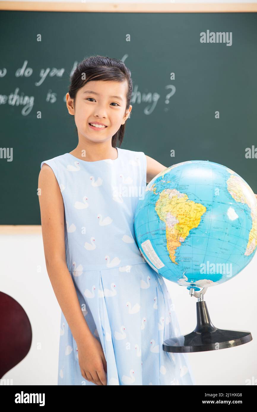 Primary school girls in the classroom Stock Photo - Alamy