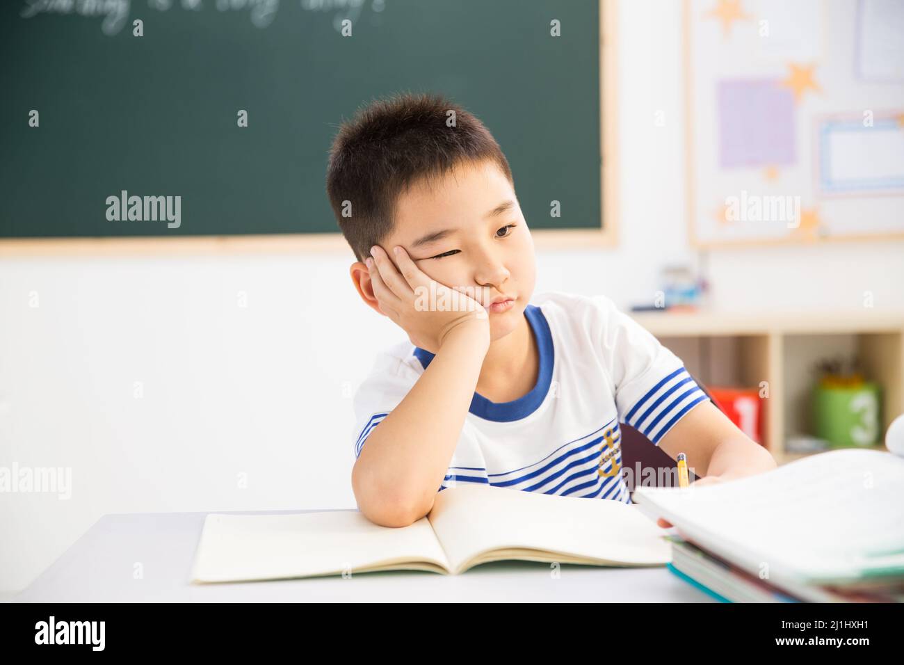 Primary school boy in the classroom Stock Photo - Alamy